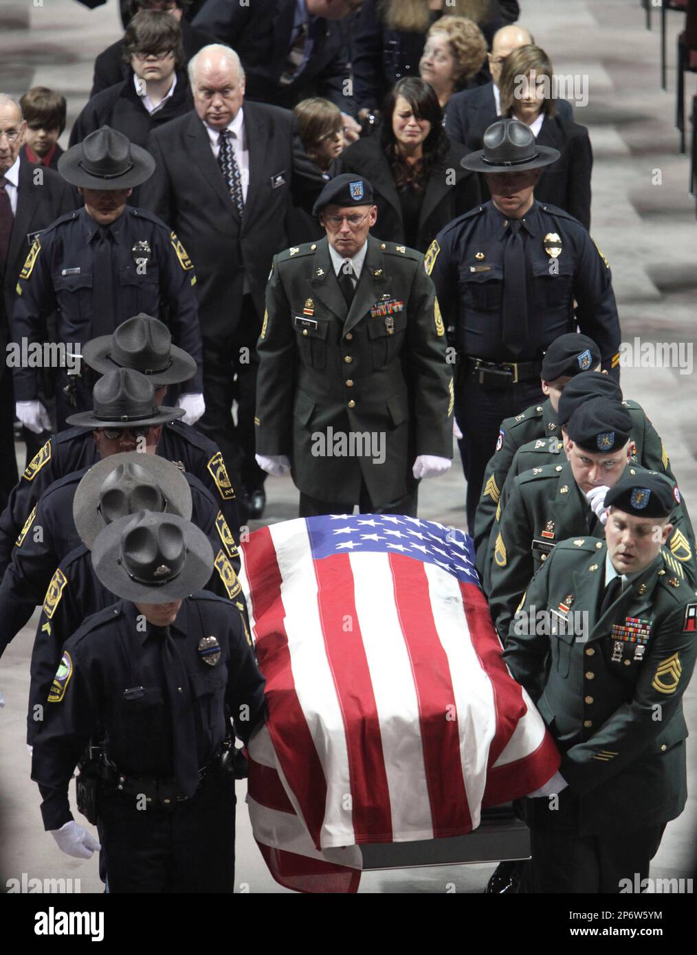The casket of Virginia Tech police officer Deriek W. Crouse is carried ...