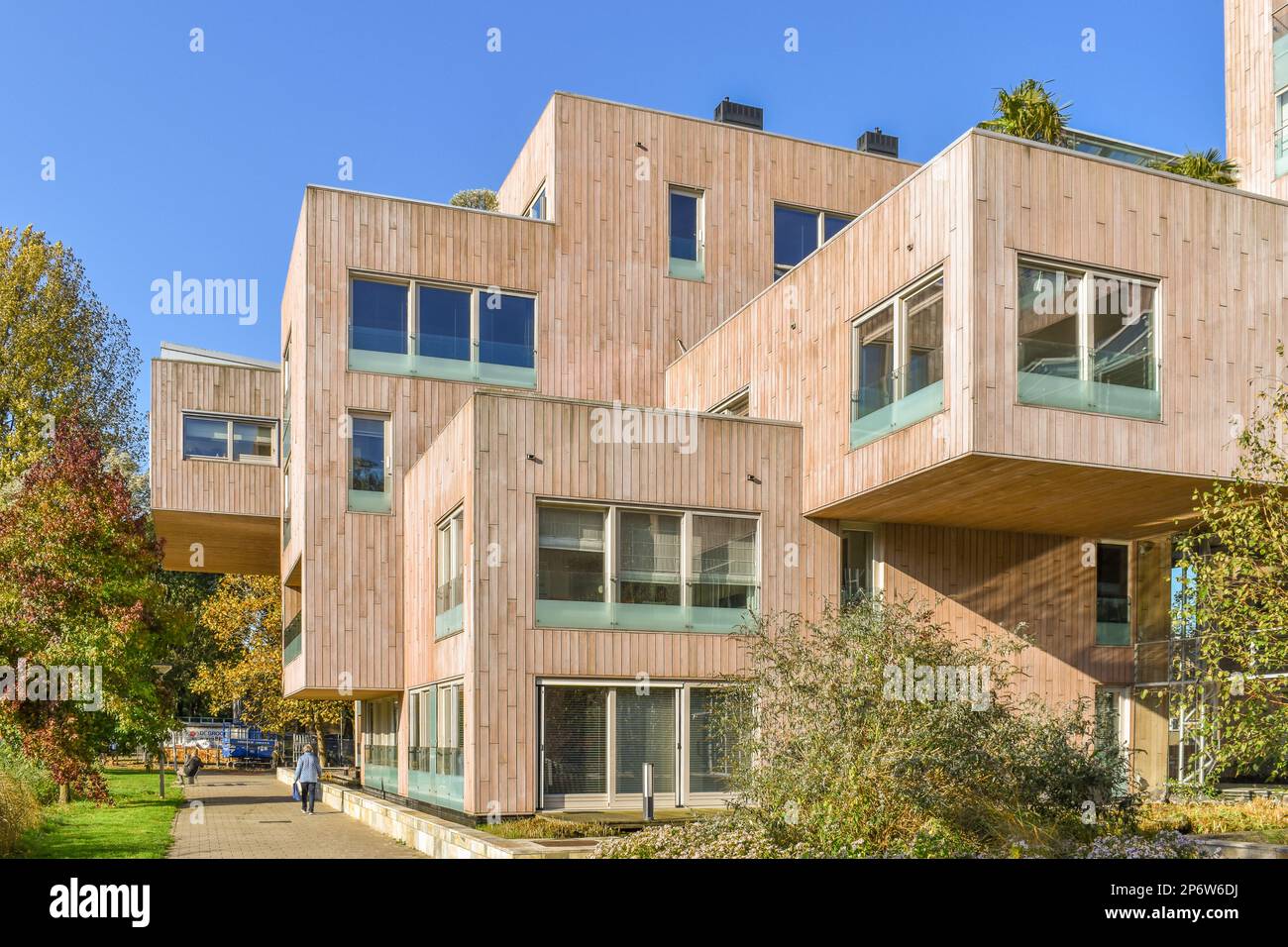 an apartment building that looks like it's made out of wood, with balks ...