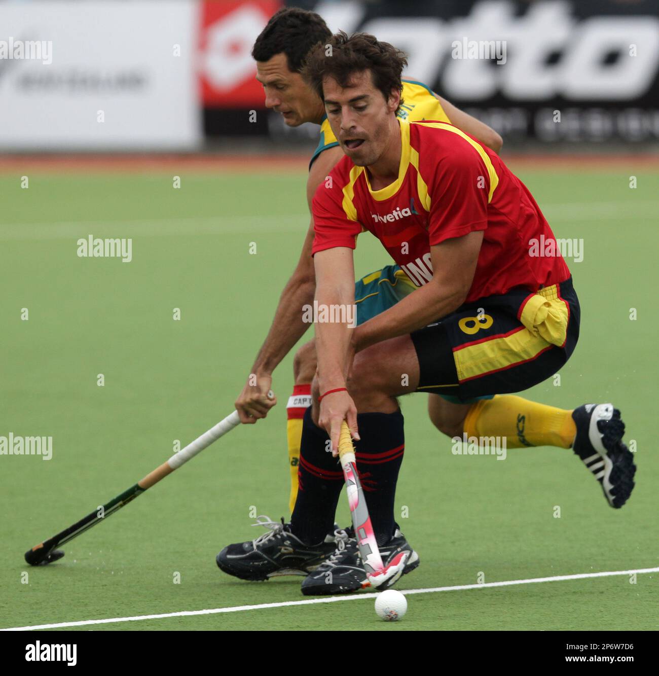 Australia's Jamie Dwyer, behind, pressures Spain's Alex Fabregas in the ...