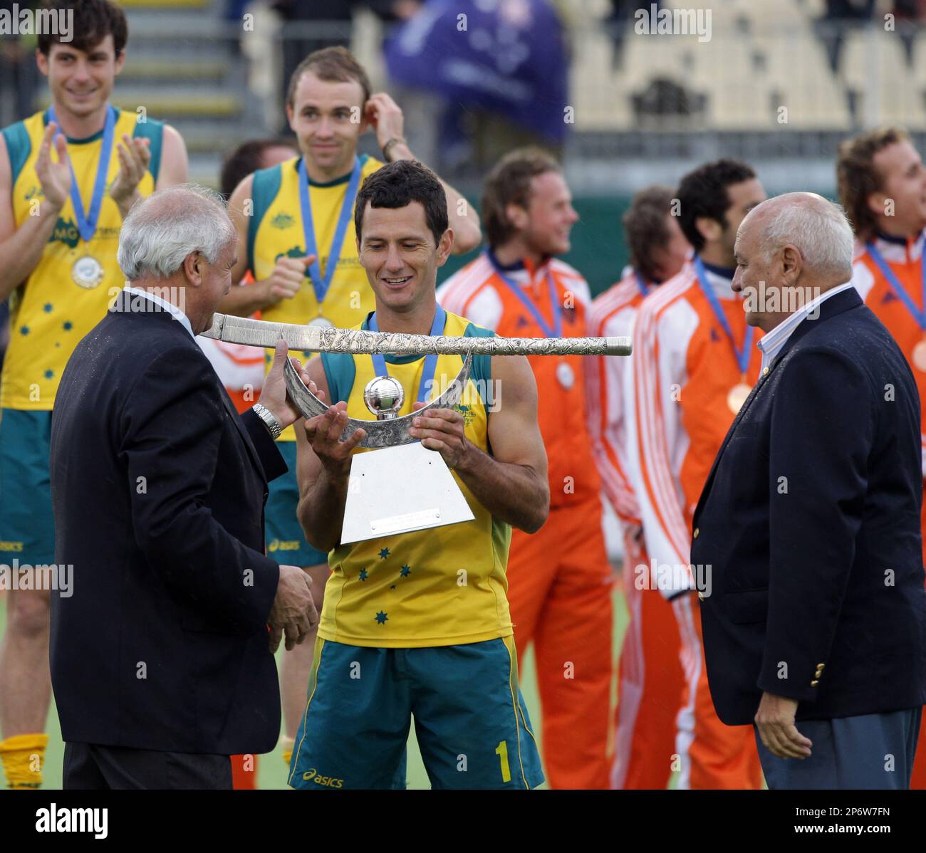 Australia's Jamie Dwyer receives the trophy after defeating Netherlands ...