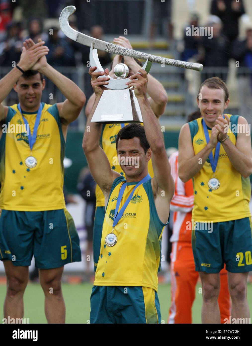Australia's Jamie Dwyer raises the trophy after defeating Netherlands ...