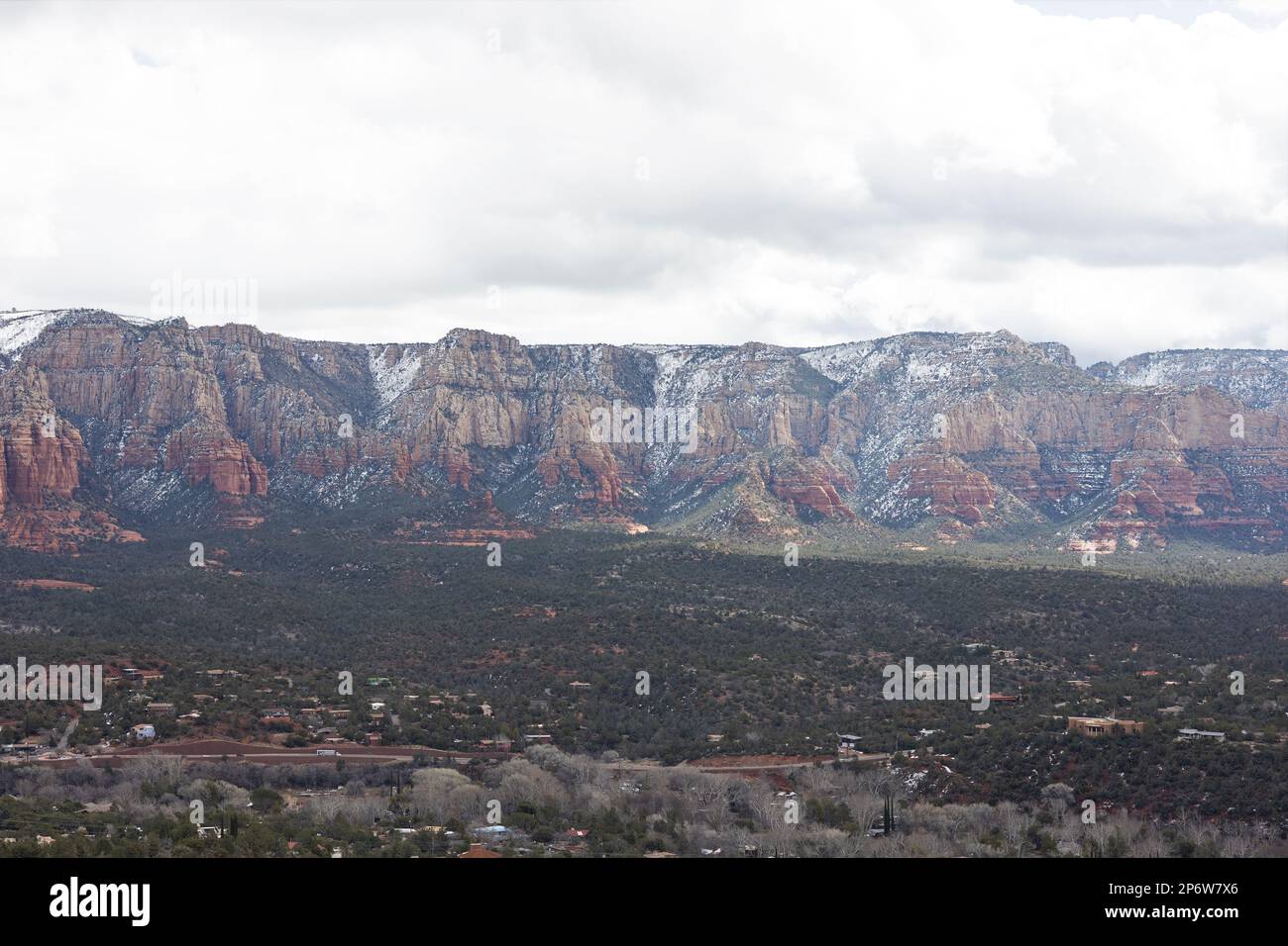 A light dusting of snow on top of red rock mountains in Sedona, Arizona ...