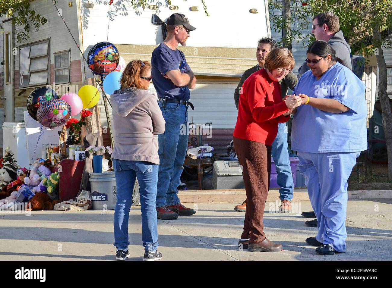 Nancy Harrop, wearing red sweater, the mother of Rachelle Grimmer, the ...