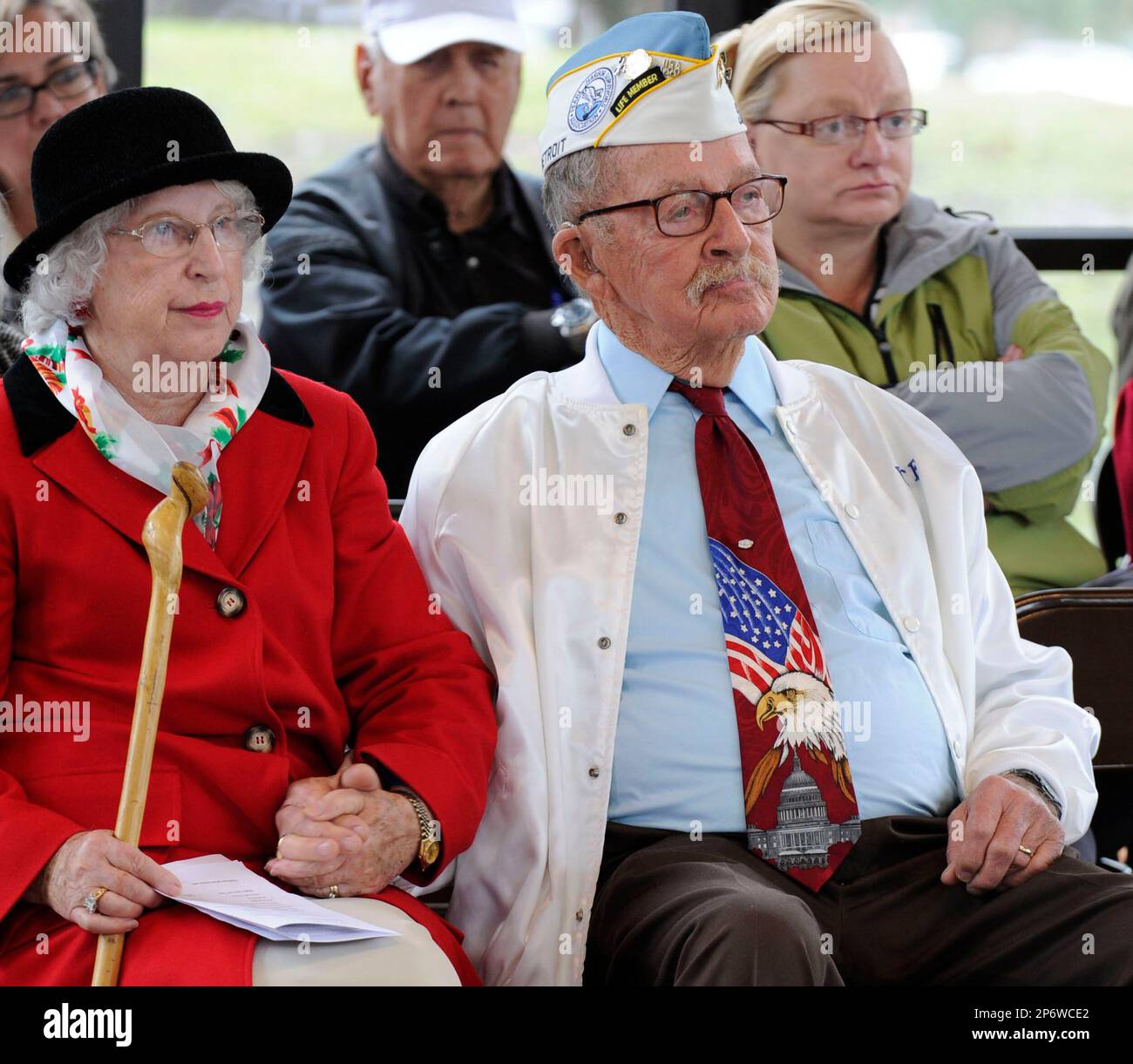 Pearl Harbor survivor Bill Ferguson holds hands with his wife, Ailene ...