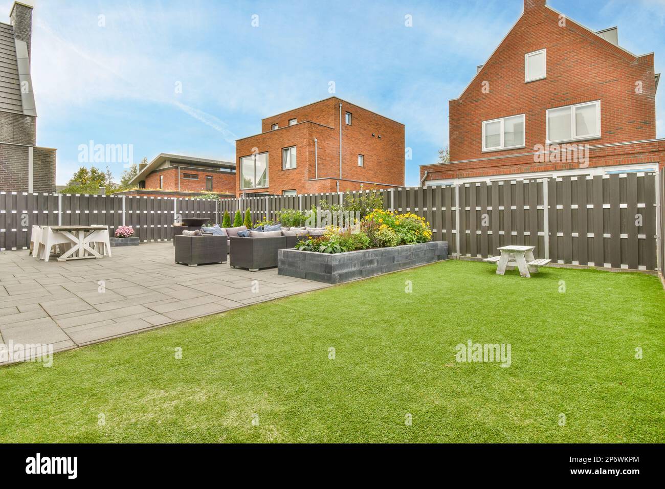 Amsterdam, Netherlands - 10 April, 2021: a backyard area with lawn and ...