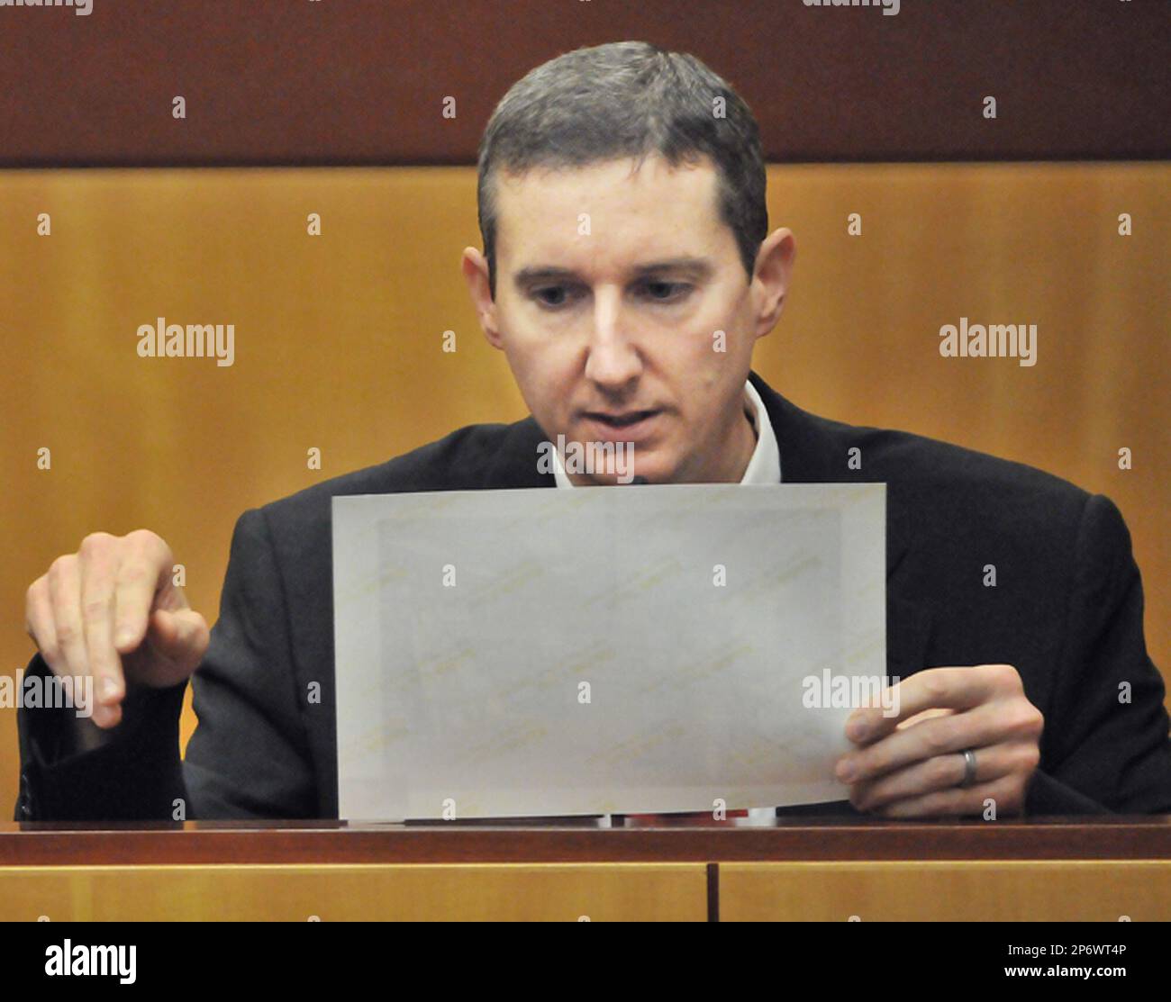 Detective Jeffrey Payette of the Major Crime Squad describes a photo ...