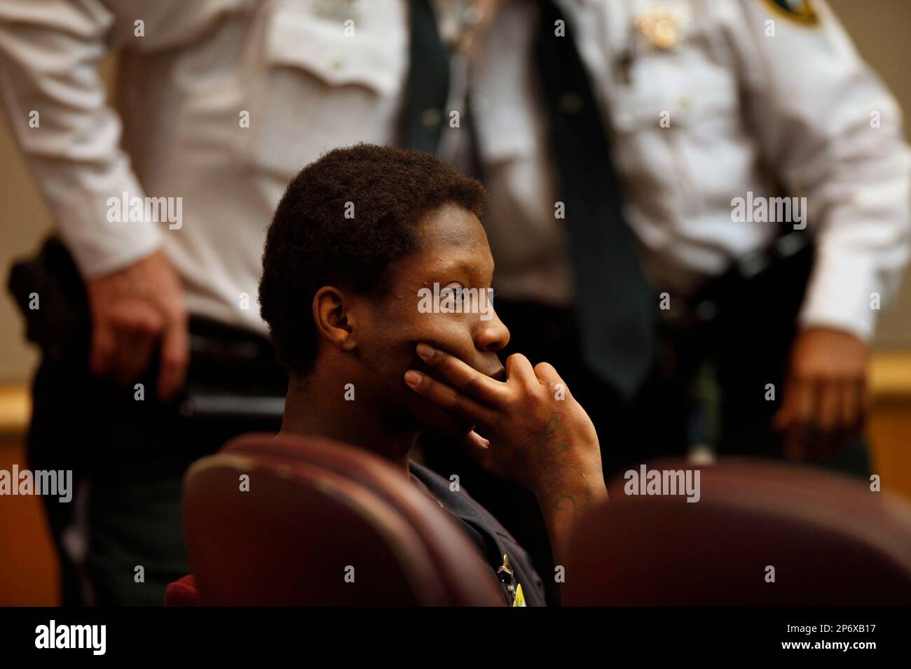 Nicholas Lindsey, center, sits with his defense attorneys in court for ...