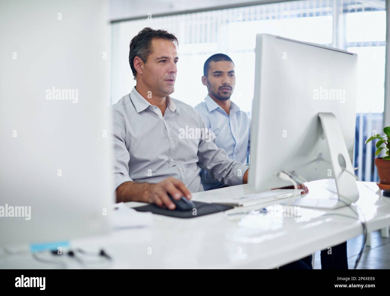 Two creative people working together hi-res stock photography and ...