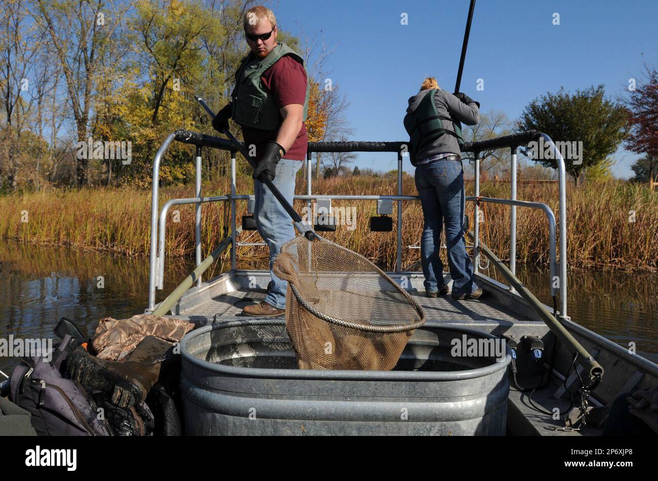 In this Oct. 24, 2011 photo, University of Minnesota technicians Brett ...