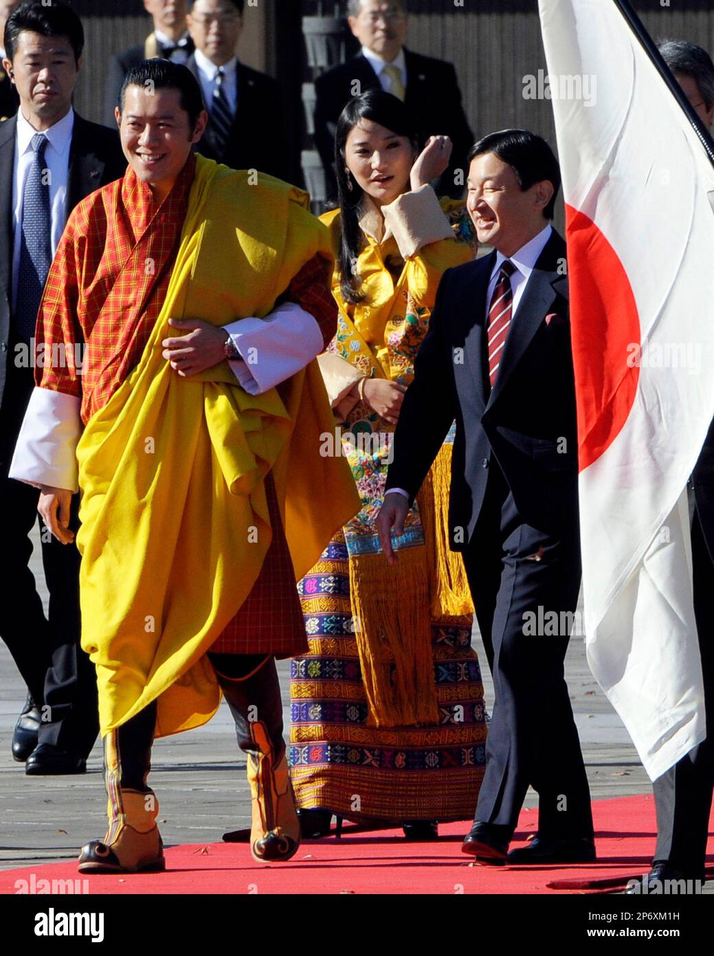 Bhutan's King Jigme Khesar Namgyal Wangchuck, from left, accompanied by Queen Jetsun Pema, walks ...