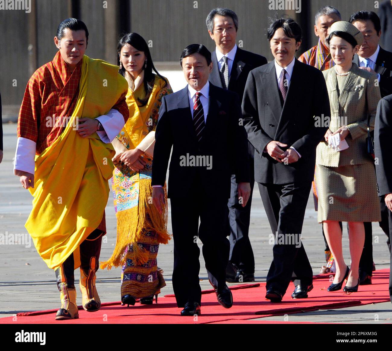 Bhutan's King Jigme Khesar Namgyal Wangchuck, left, accompanied by Queen Jetsun Pema, walks with ...