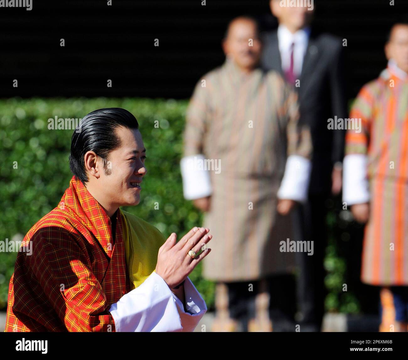 Bhutan's King Jigme Khesar Namgyal Wangchuck, left, gestures while ...