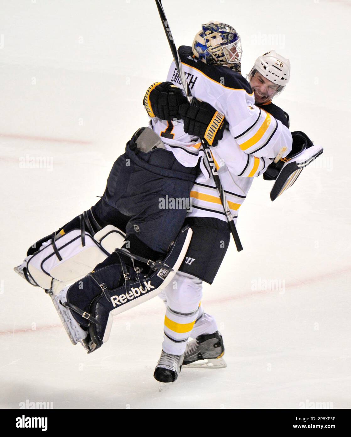 Buffalo Sabres goalie Jhonas Enroth leaps into the arms of teammate ...