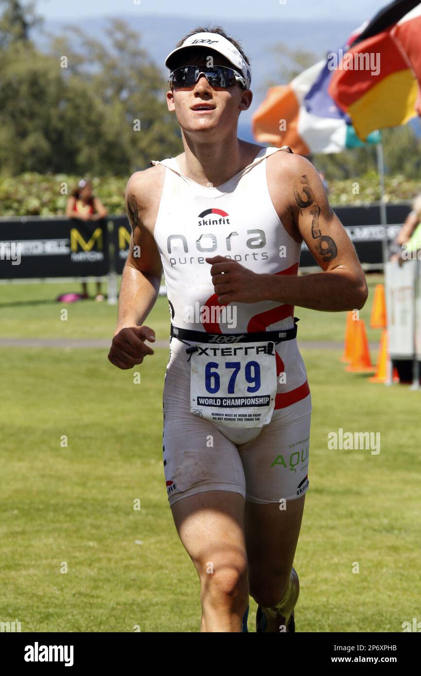 Dominik Wychera, of Austria, crosses the finish line at the 2011 XTERRA ...