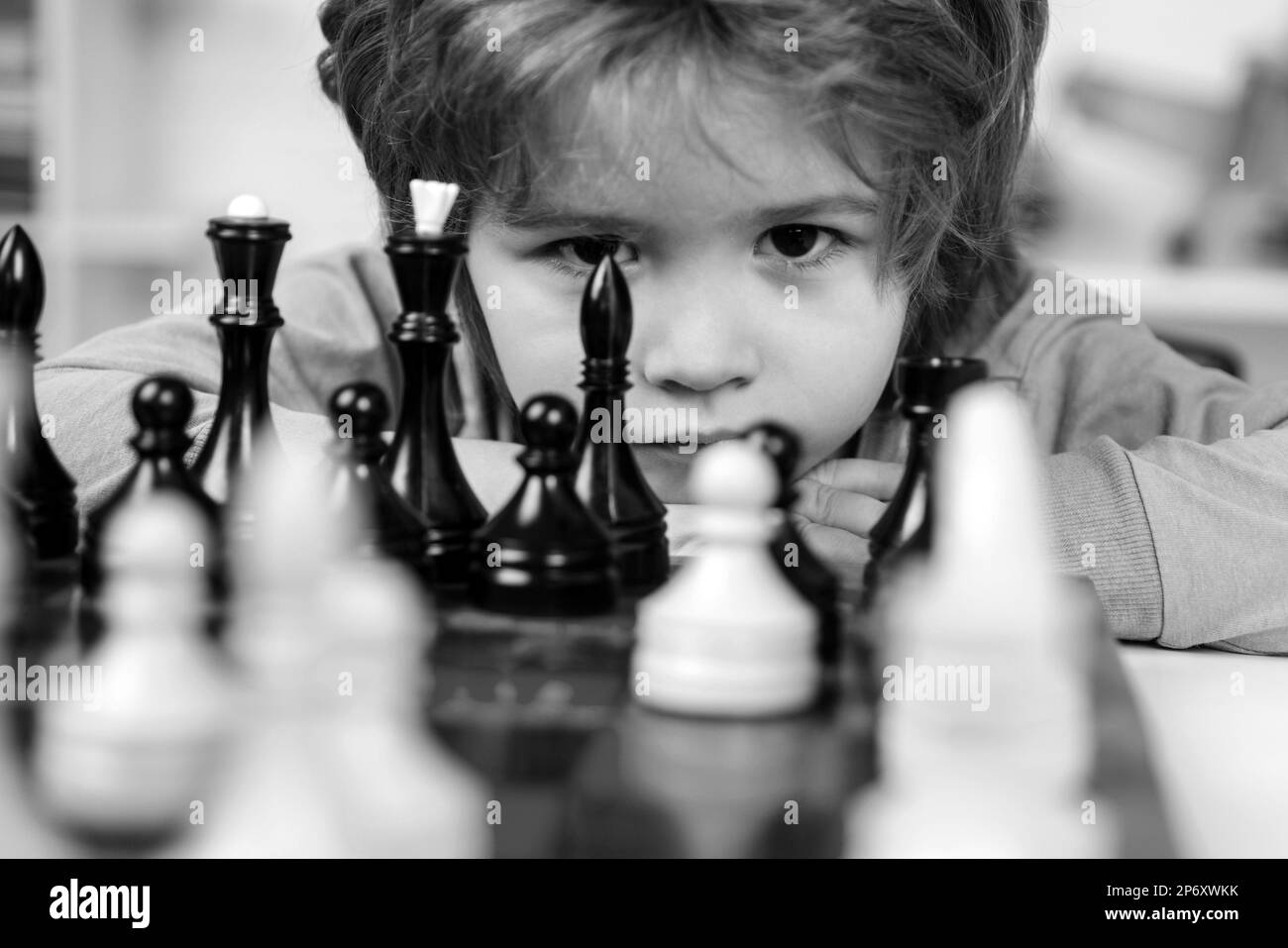 Little boy playing chess. Kids educational games, child early ...