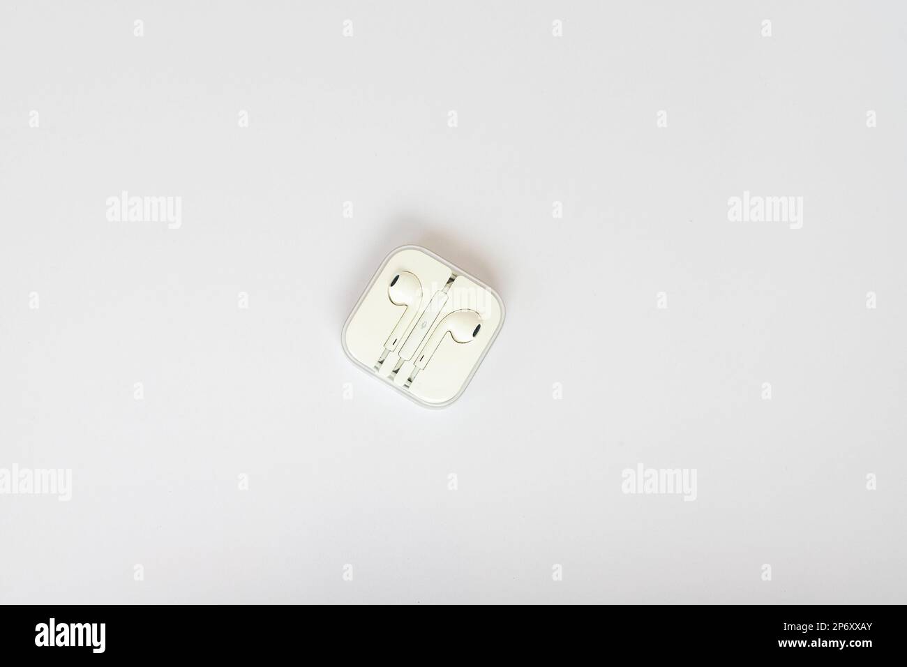 Earphones isolated on a white background Stock Photo - Alamy