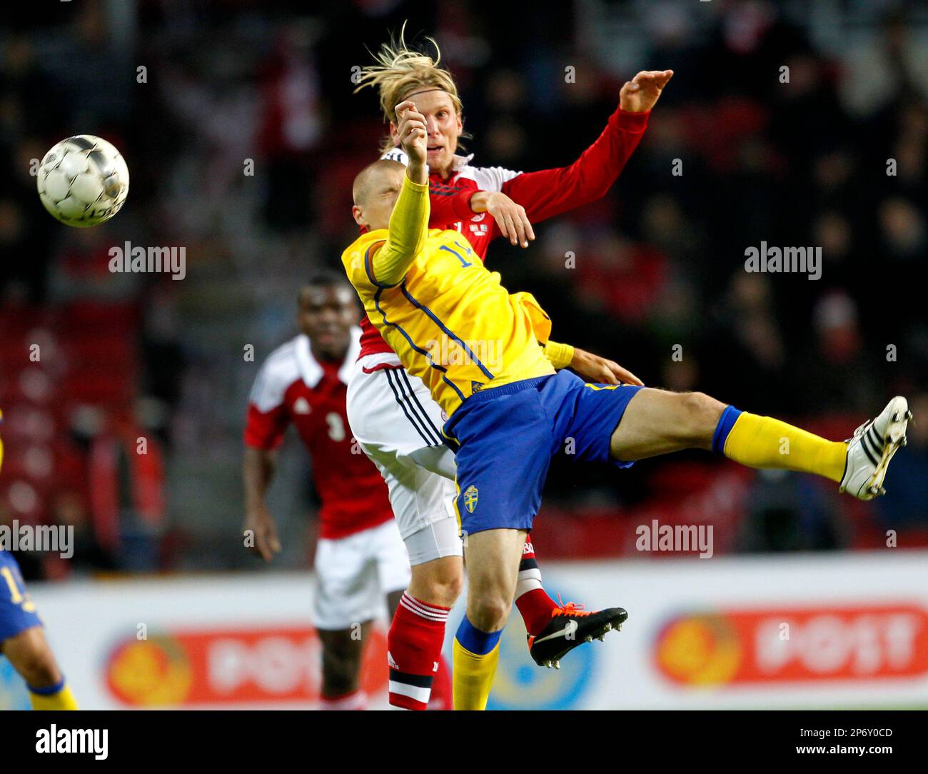 Denmark's Christian Poulsen fights for the ball with Sweden's Samuel ...