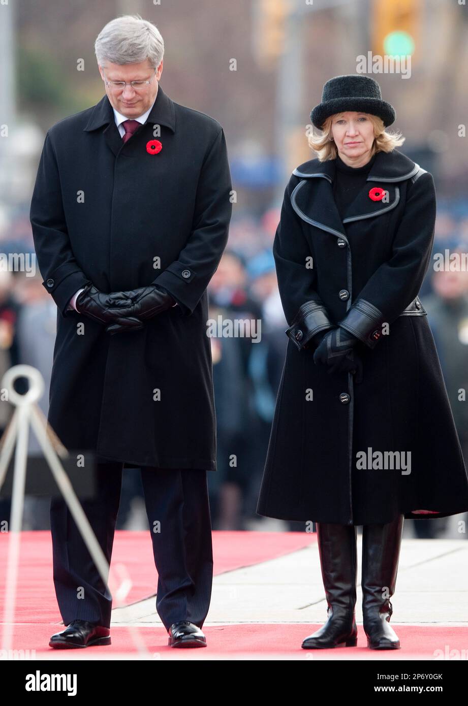 Prime Minister Stephen Harper and his wife Laureen pause during ...