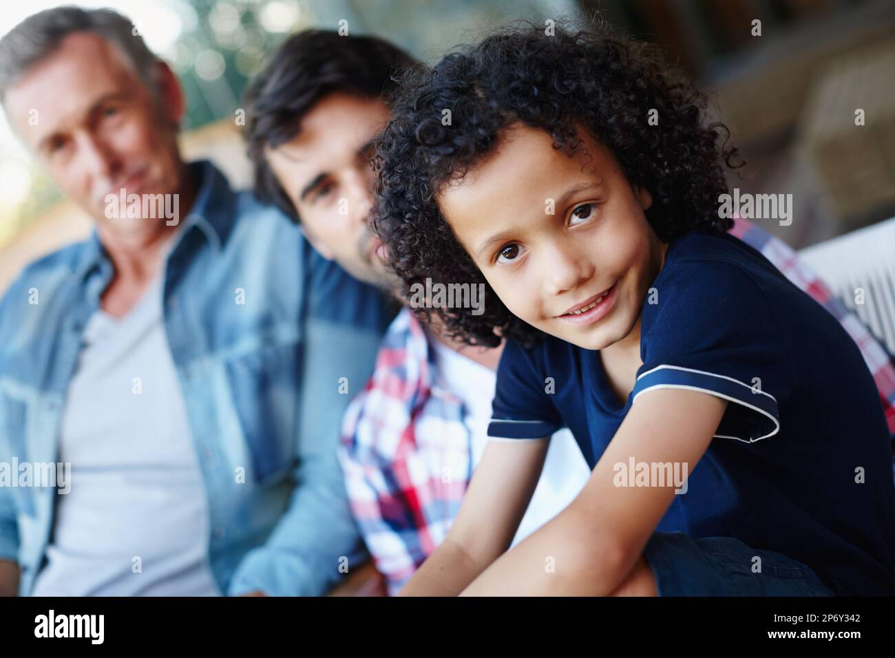 Secure in their care. Three generations of males from one family ...