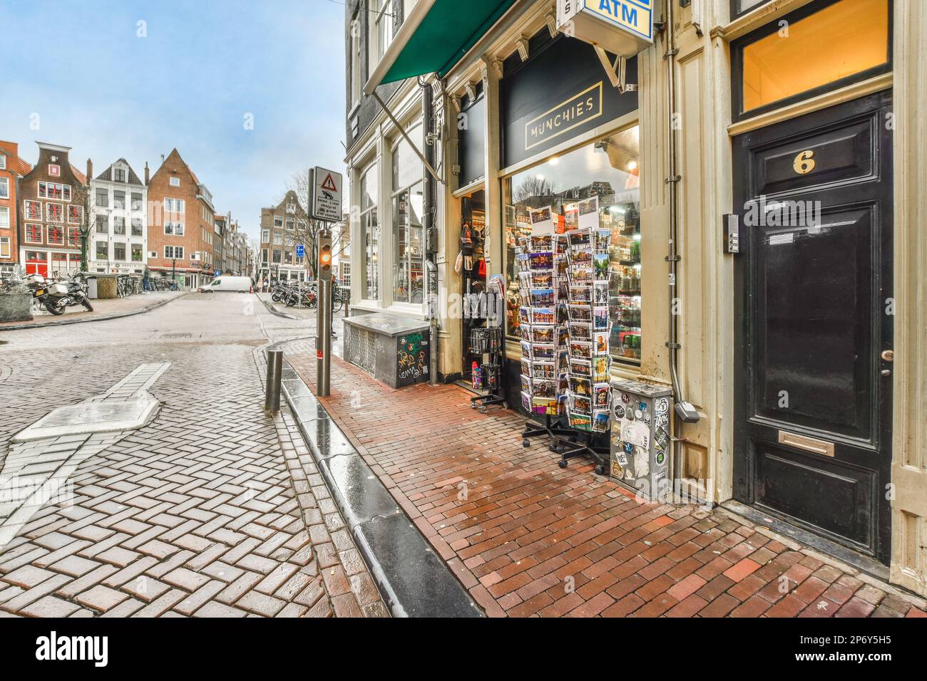 a city street with buildings and shops on both sides in the photo is ...
