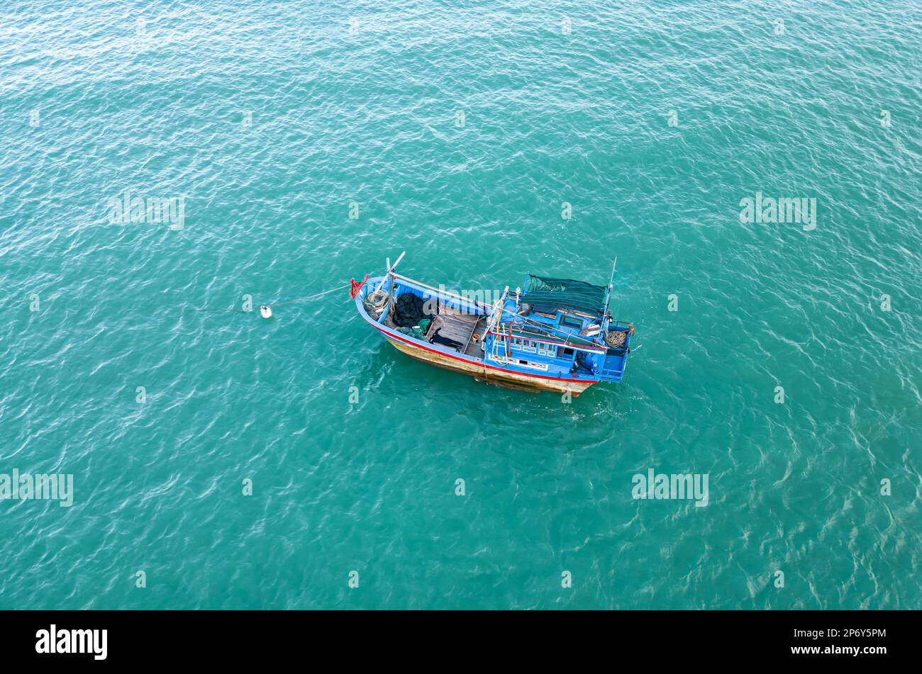 Local fishing boat on sea, drone view. Vintage colourful boat with ...