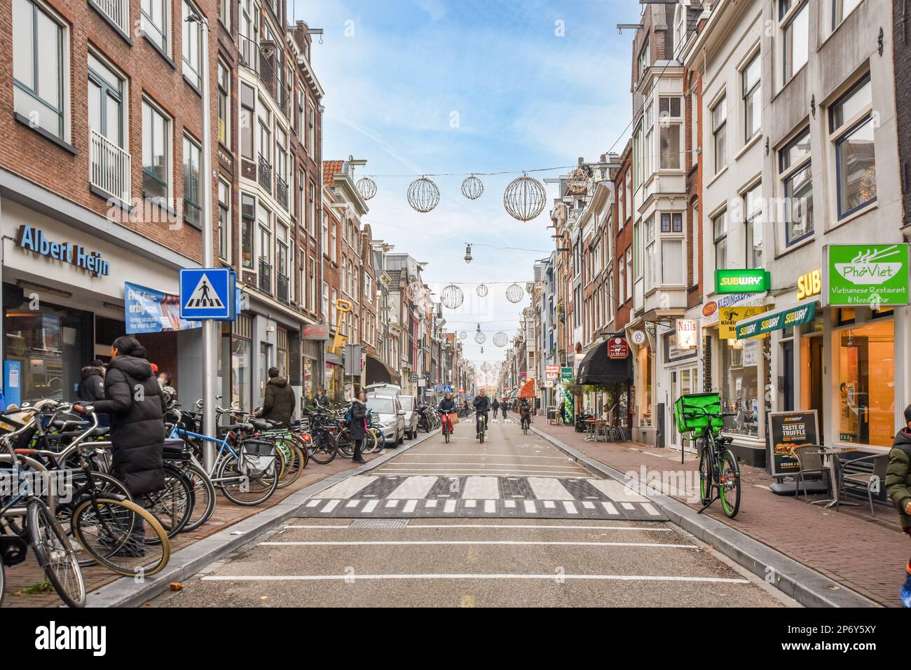 Amsterdam, Netherlands - 10 April, 2021: a city street with people ...
