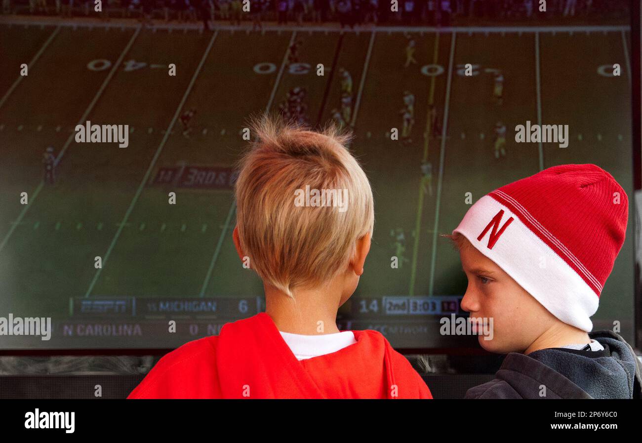 Pierce Branting (left) and Jake Scherer watch Michigan vs. Iowa on a ...