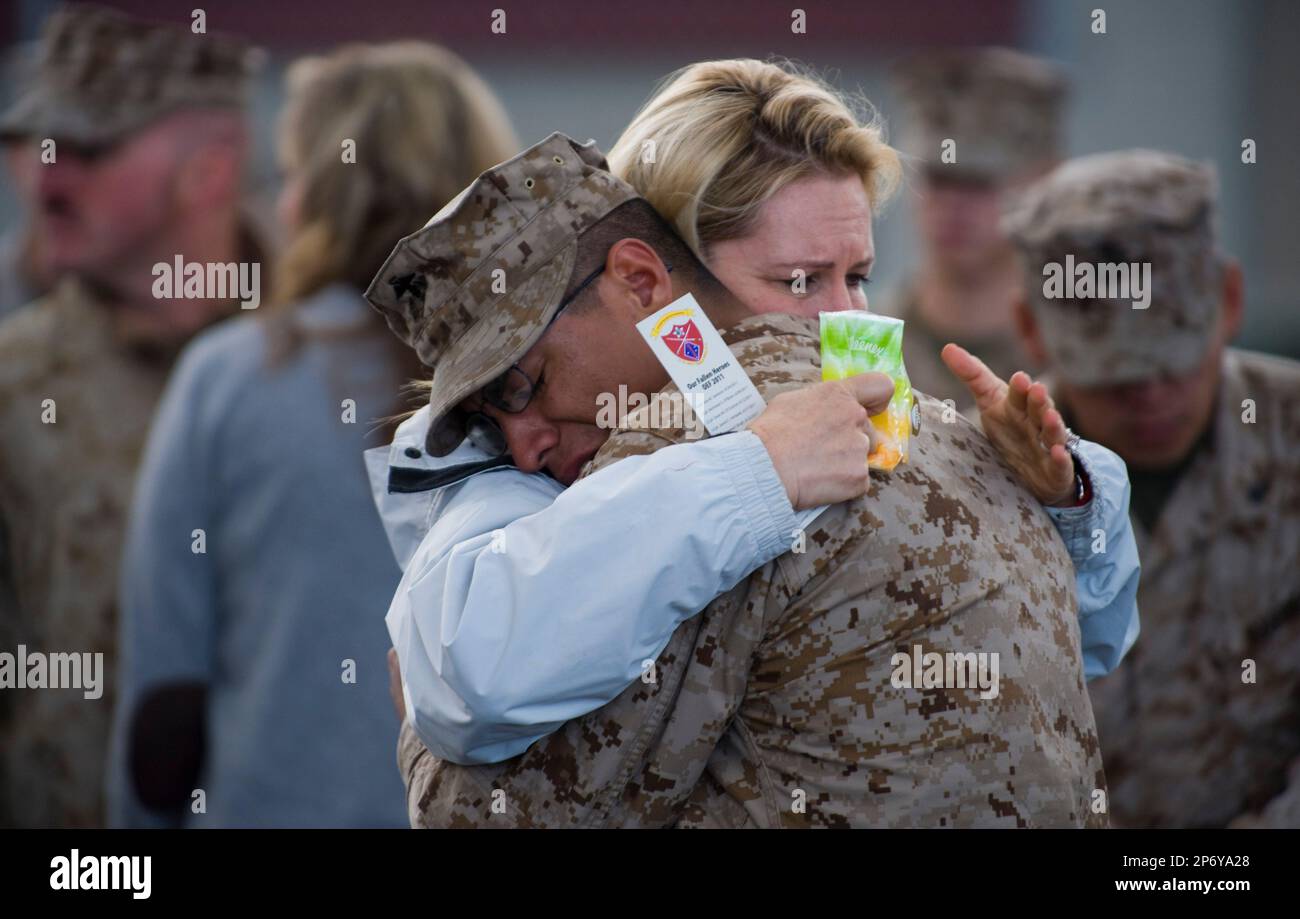 A Marine is consoled as Marines, families and friends pay their ...