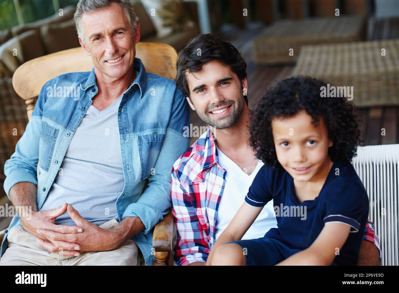 Father and son time. Three generations of males from one family sitting ...