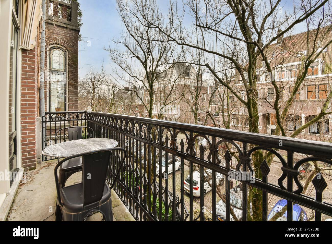 an outside area with trees and buildings in the background, taken from ...