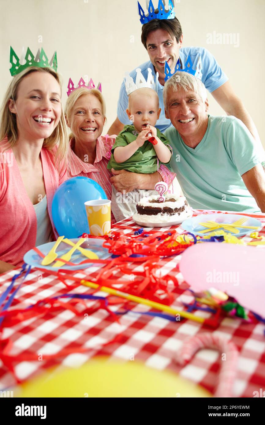 Party time. a happy multi-generational family celebrating a birthday ...