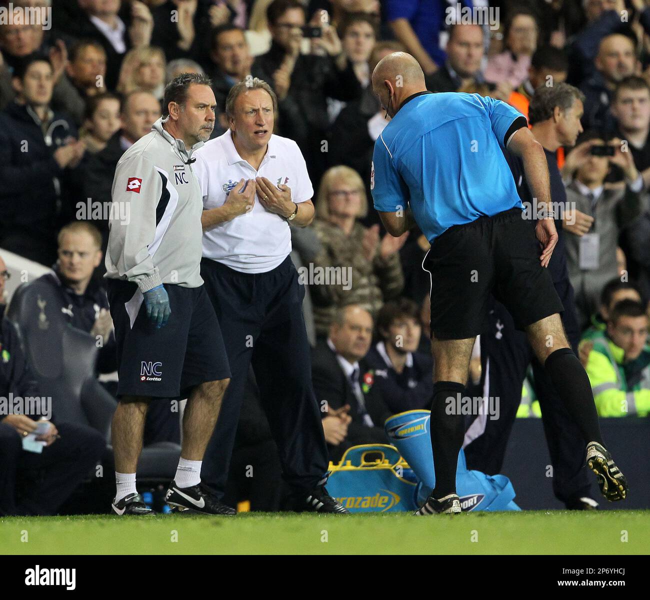 QPRs Neil Warnock has words with referee Howard Webb..Barclays Premier ...