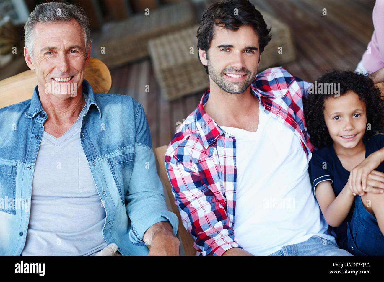Forging strong family bonds together. Three generations of males from ...