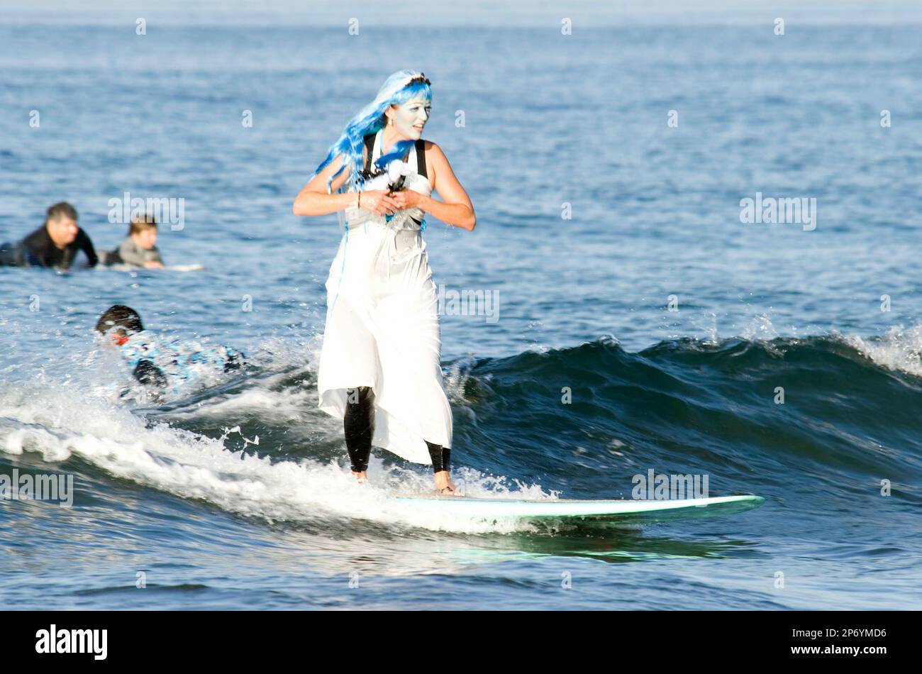 Bridget Arthur of Costa Mesa brings out her flowers for the full effect ...