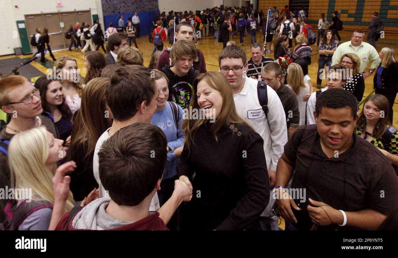 Traverse City West High School teacher Juleen Jenkins, center, greets ...