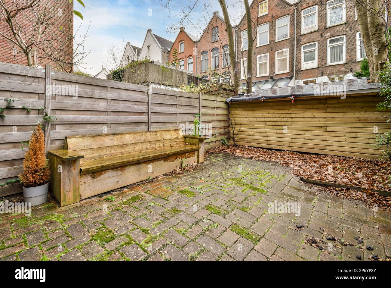 Amsterdam, Netherlands - 10 April, 2021: a back yard with a wooden ...