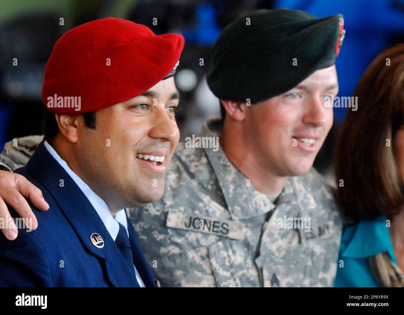 Air Force Staff Sgt. Robert Gutierrez, left, poses for a picture with ...