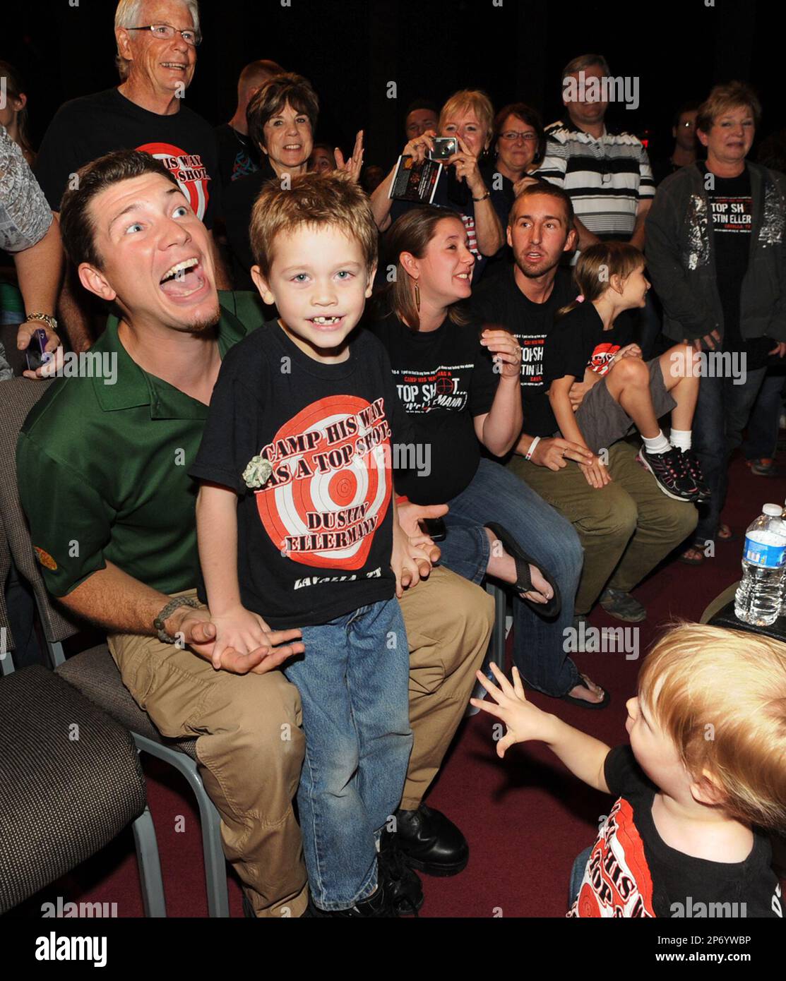 Shooting competitor Dustin Ellermann, left, oldest son Kody, 5, wife ...