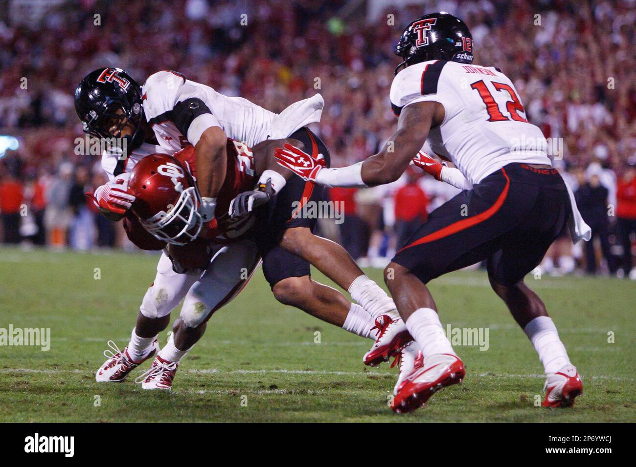 22 October 2011: Terrance Bullitt (1) jumps on the back of Roy Finch ...