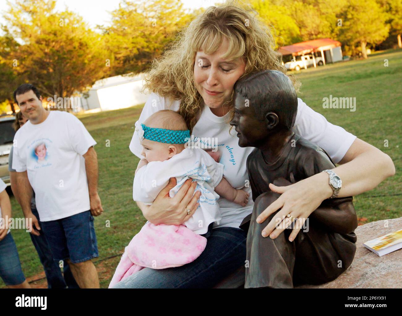 Renee Haley hugs a life-sized statue of her deceased son, Austin Haley ...