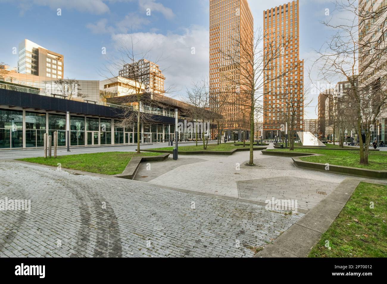 a city square in the middle of an urban area with tall buildings on ...