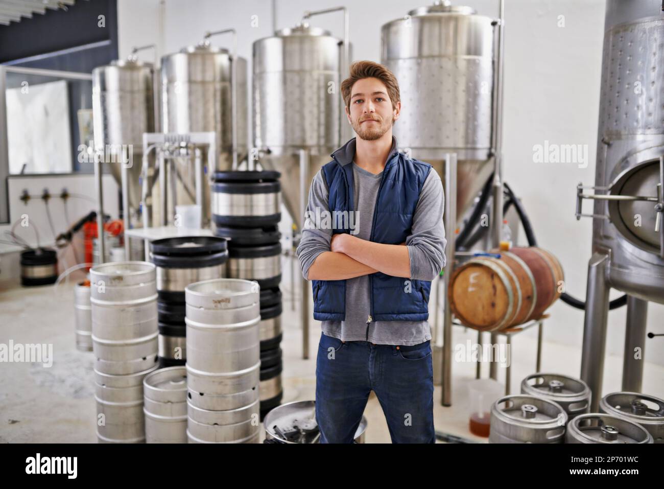 Welcome to my brewery. a man working in a microbrewery Stock Photo - Alamy