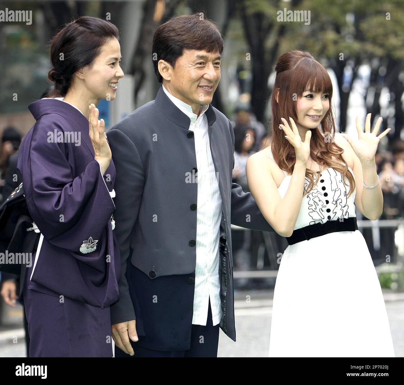 Hong Kong movie star Jackie Chan (C), Japanese actress Makkiko Esumi ...