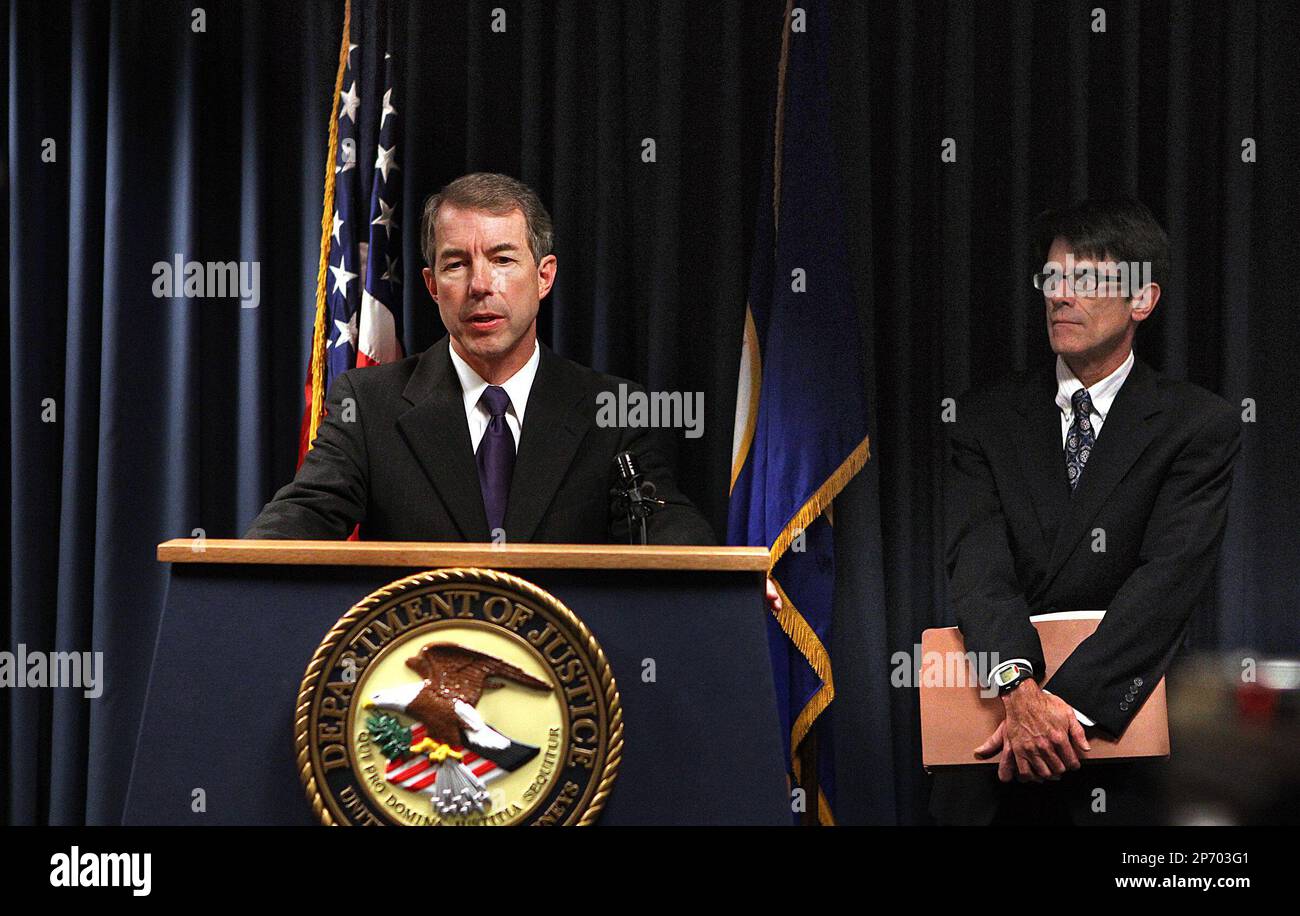 Assistant U.S. Attorney Jeffrey Paulsen, left, speaks during a news ...