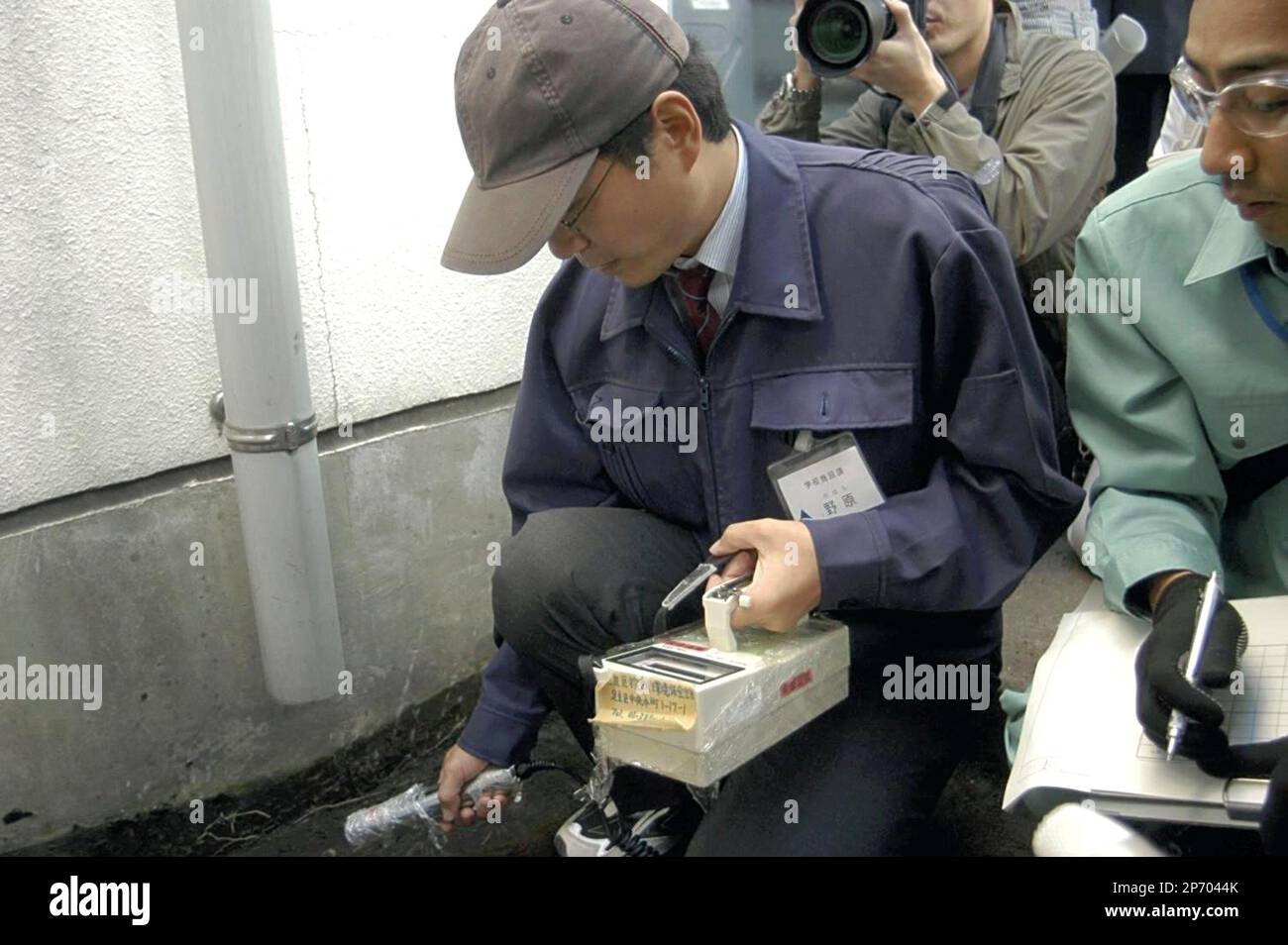 An official of Adachi Ward, measures radiation level during ...