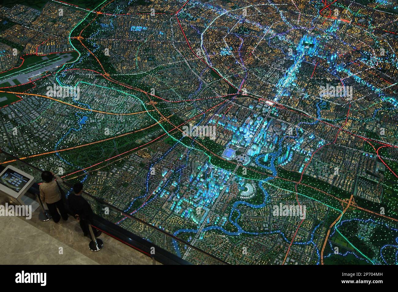 Visitors look at the Chengdu city model at the Chengdu Planning Hall in ...