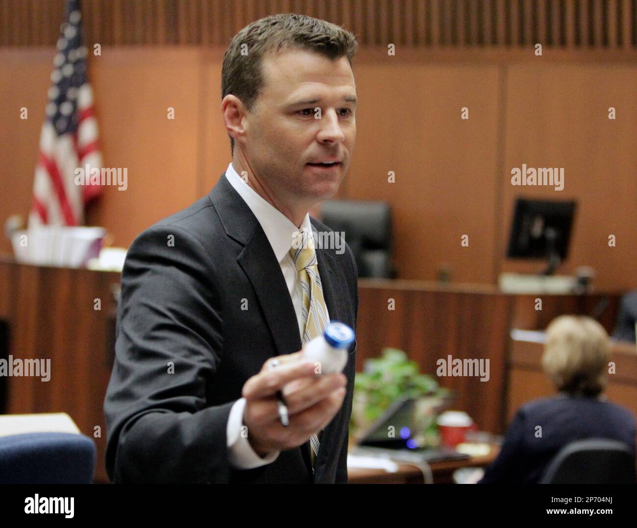 Deputy district attorney David Walgren holds a propofol bottle during ...