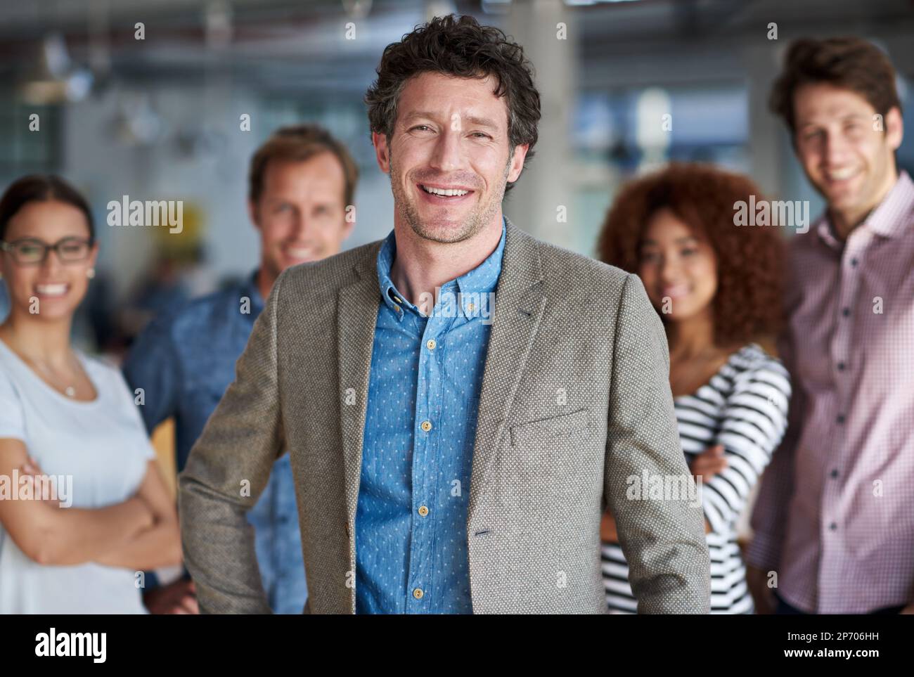Stepping forward into a leadership role. Mature man smiling at the ...