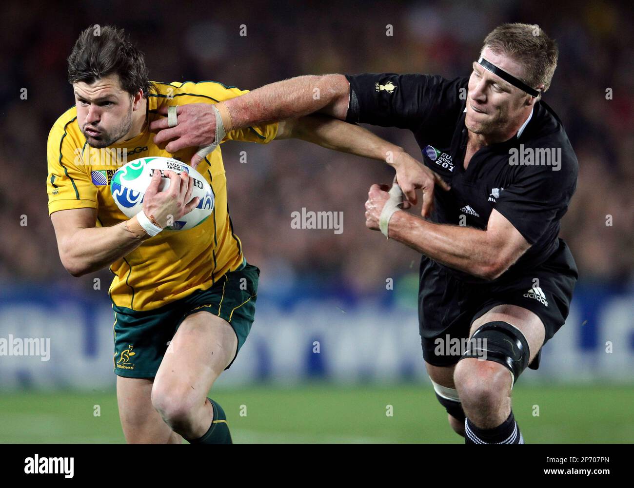 Australia's Adam Ashley-Cooper, left, is tackled by New Zealand All ...