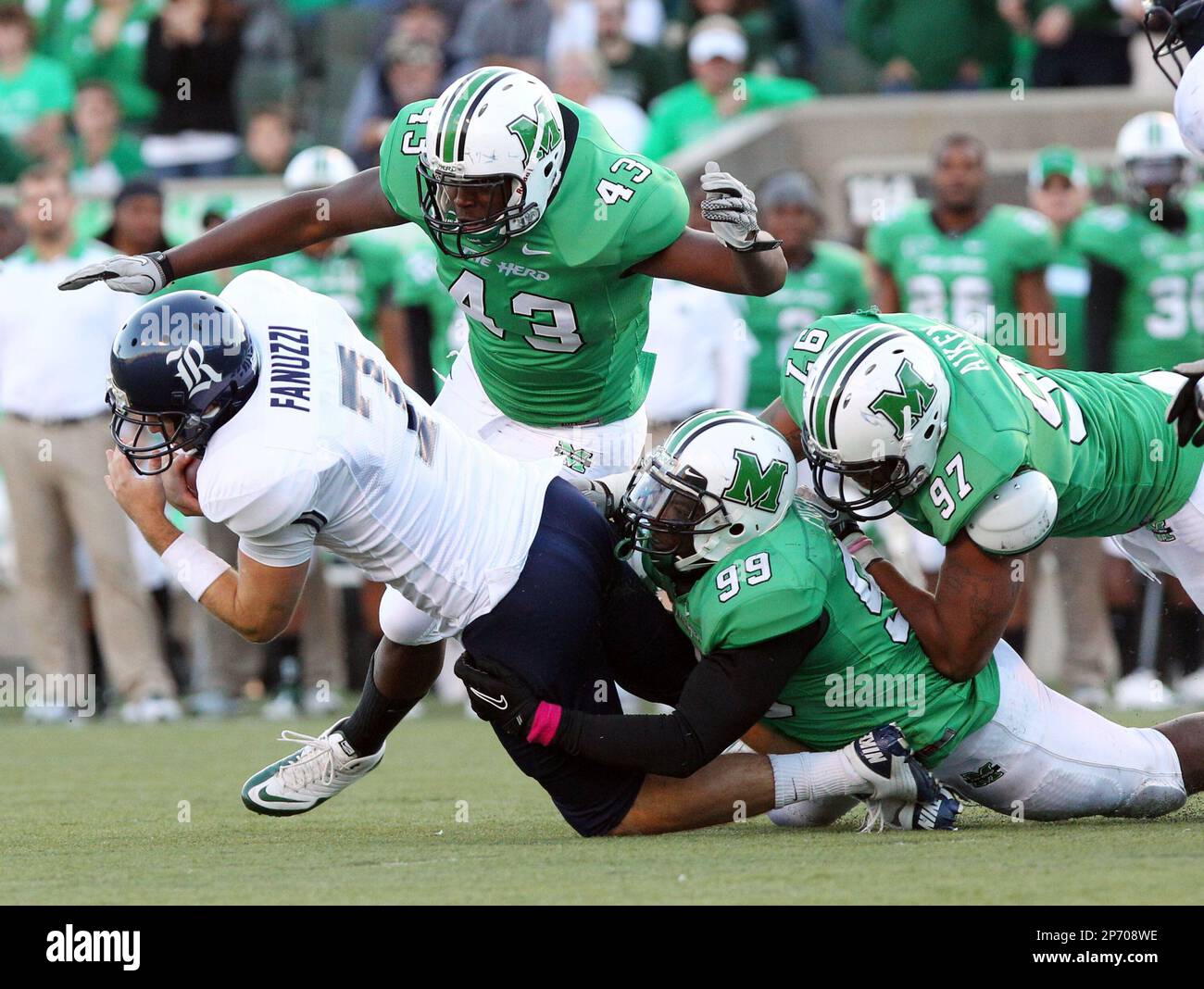 Marshall defenders Trevor Black (43), Vinny Curry (99), and Marques ...